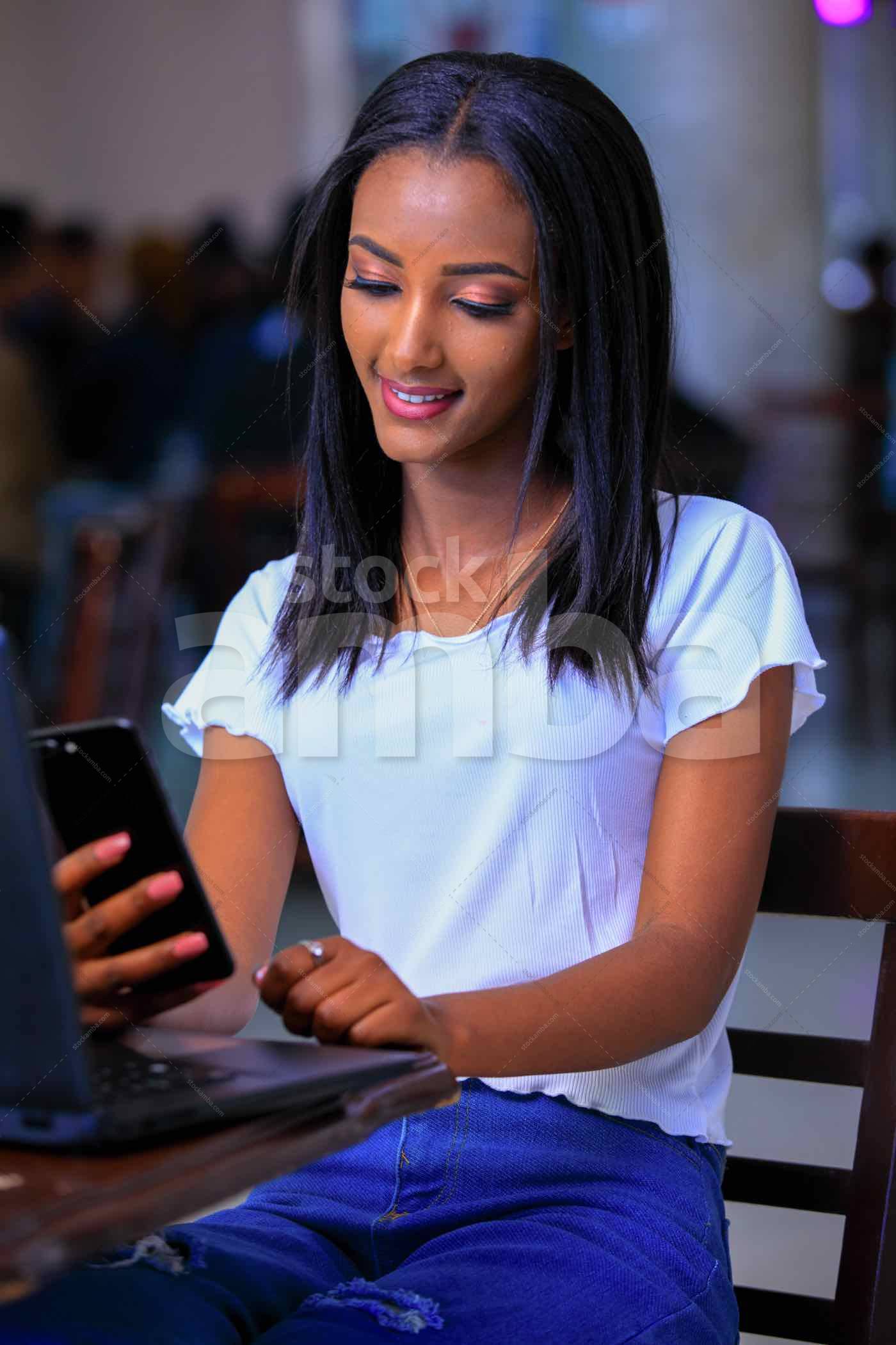 Woman Making a Video Call with Smile - StockAMBA.com